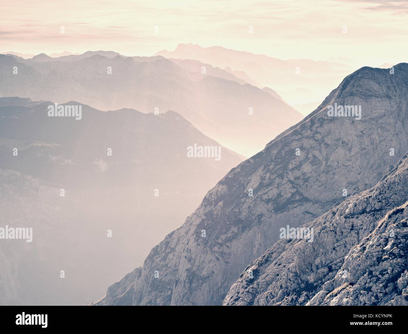 View over high sharp mountain peaks from plane, beautiful view ...