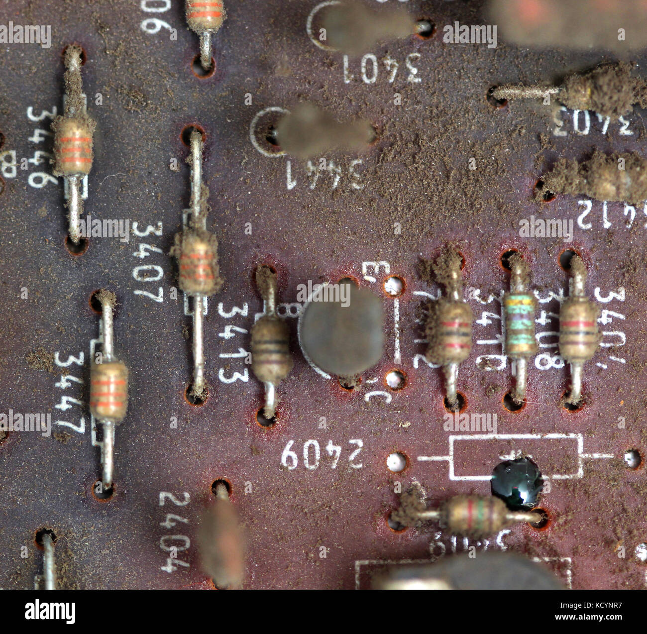 Part of old vintage printed circuit board with electronic components ...