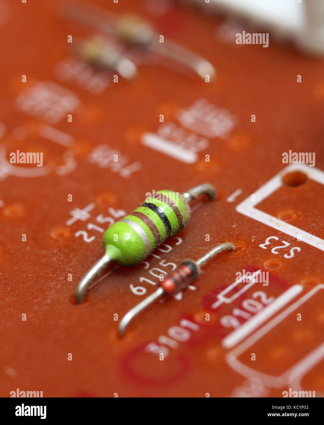 Part of old vintage printed circuit board with electronic components ...