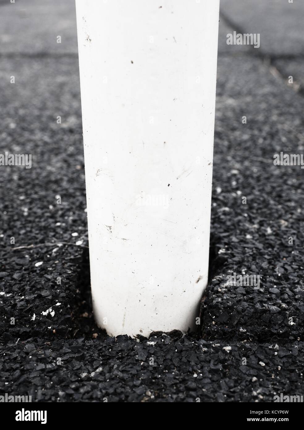 Pole in flexible tile for playground. Tiles made from a mixture of ...