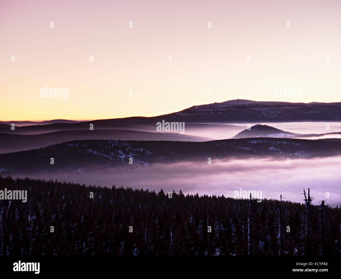 Highest hills above inverse mist. Winter cold weather in mountains ...