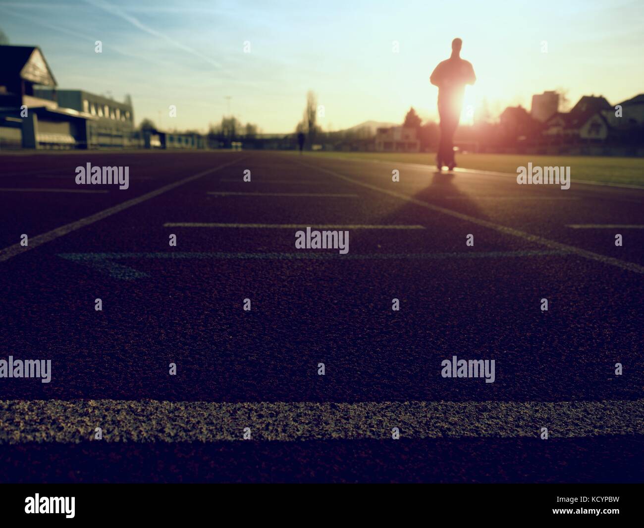 Marathon man training. Sportsman in running clothes on stadium at ...