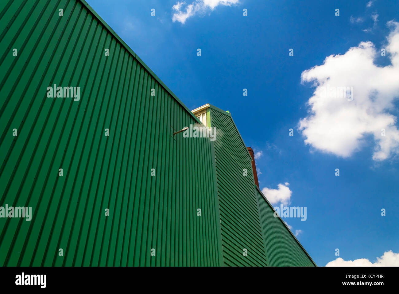Warehouse exterior on a blue sky Stock Photo - Alamy