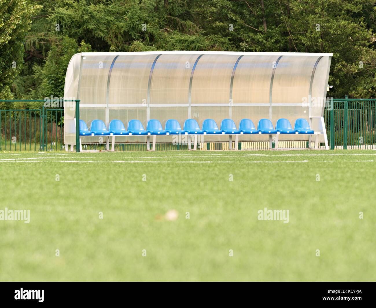 New blue plastic seats on outdoor stadium players bench, chairs with ...