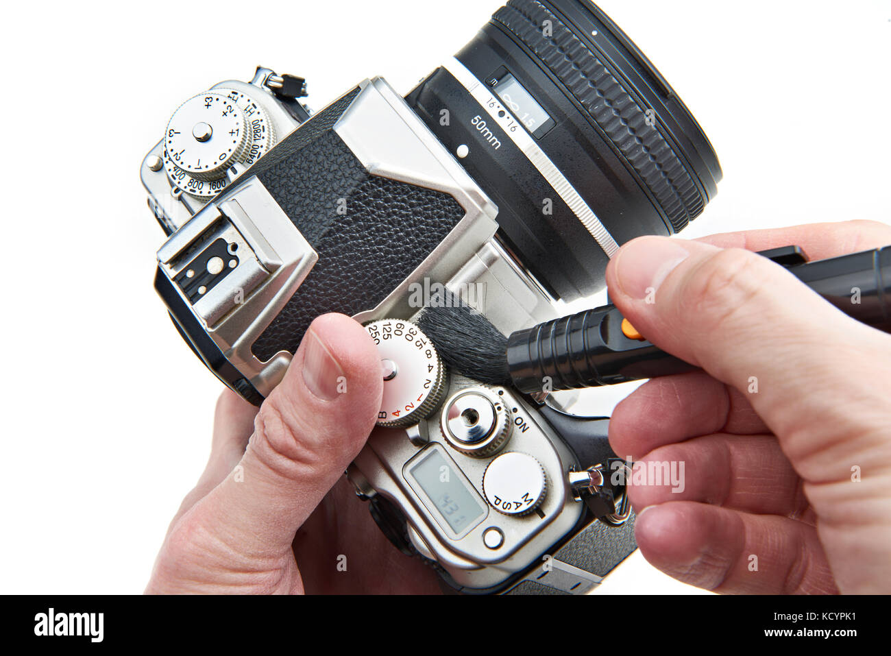 Cleaning body photographic DSLR camera from dust with a brush Stock ...
