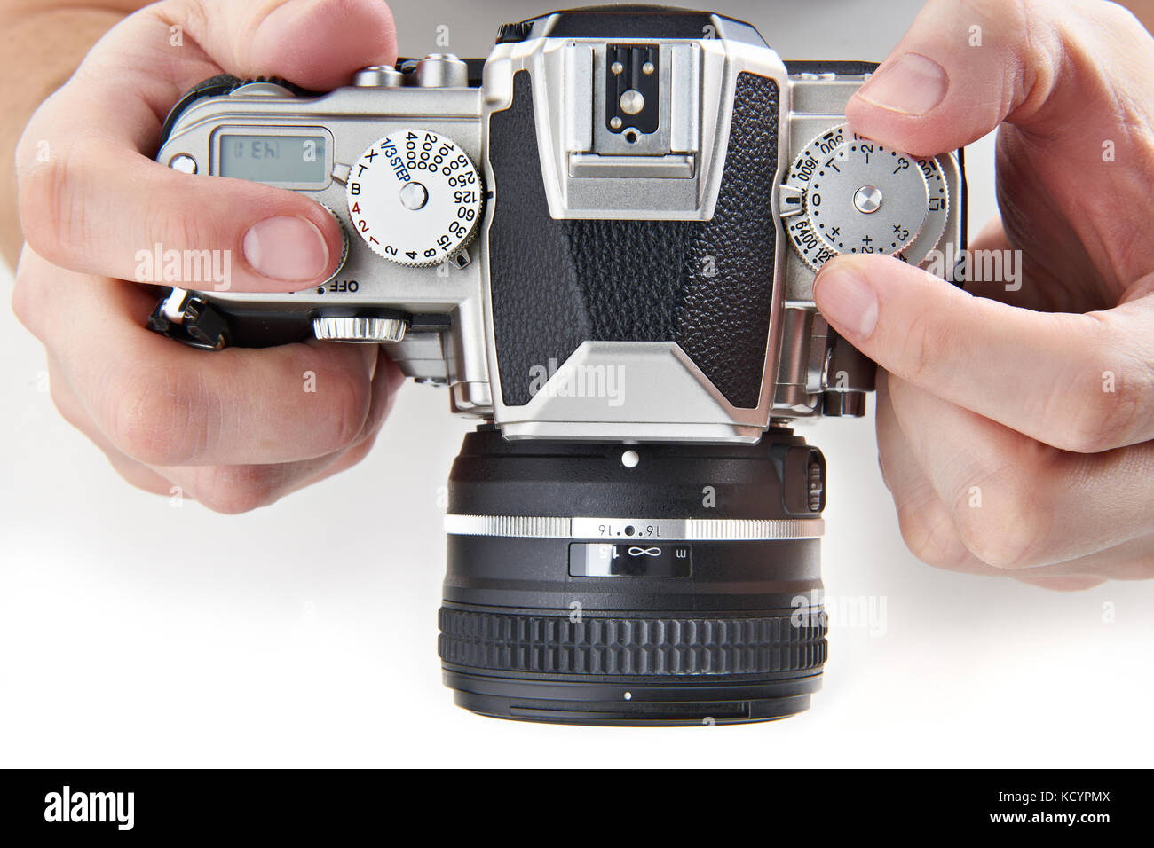 Retro SLR camera in the hands of the photographer closeup Stock Photo ...