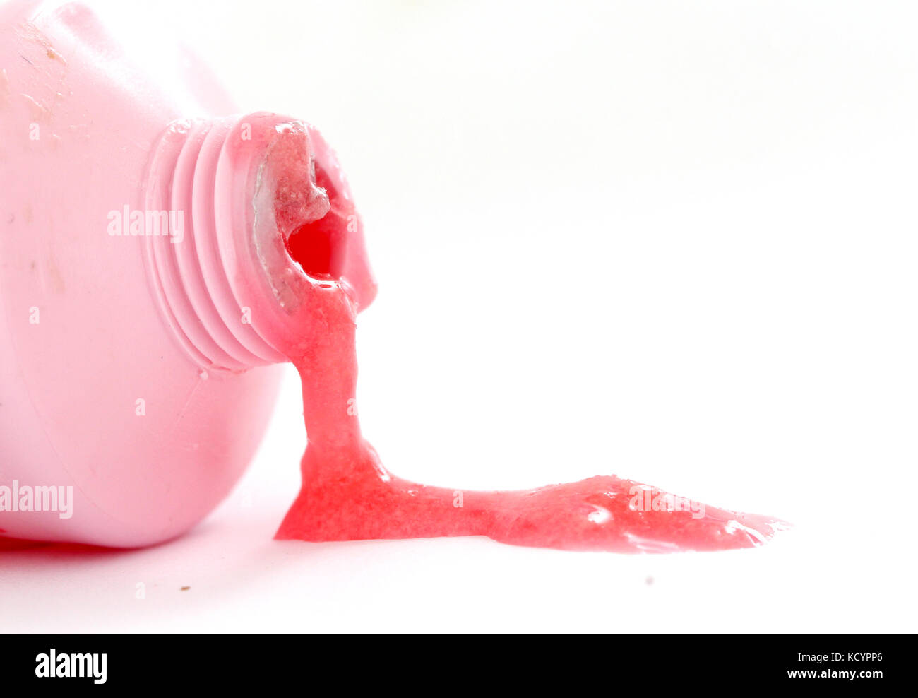 chewing gum with strawberry flavor flows out from tube on white Stock ...