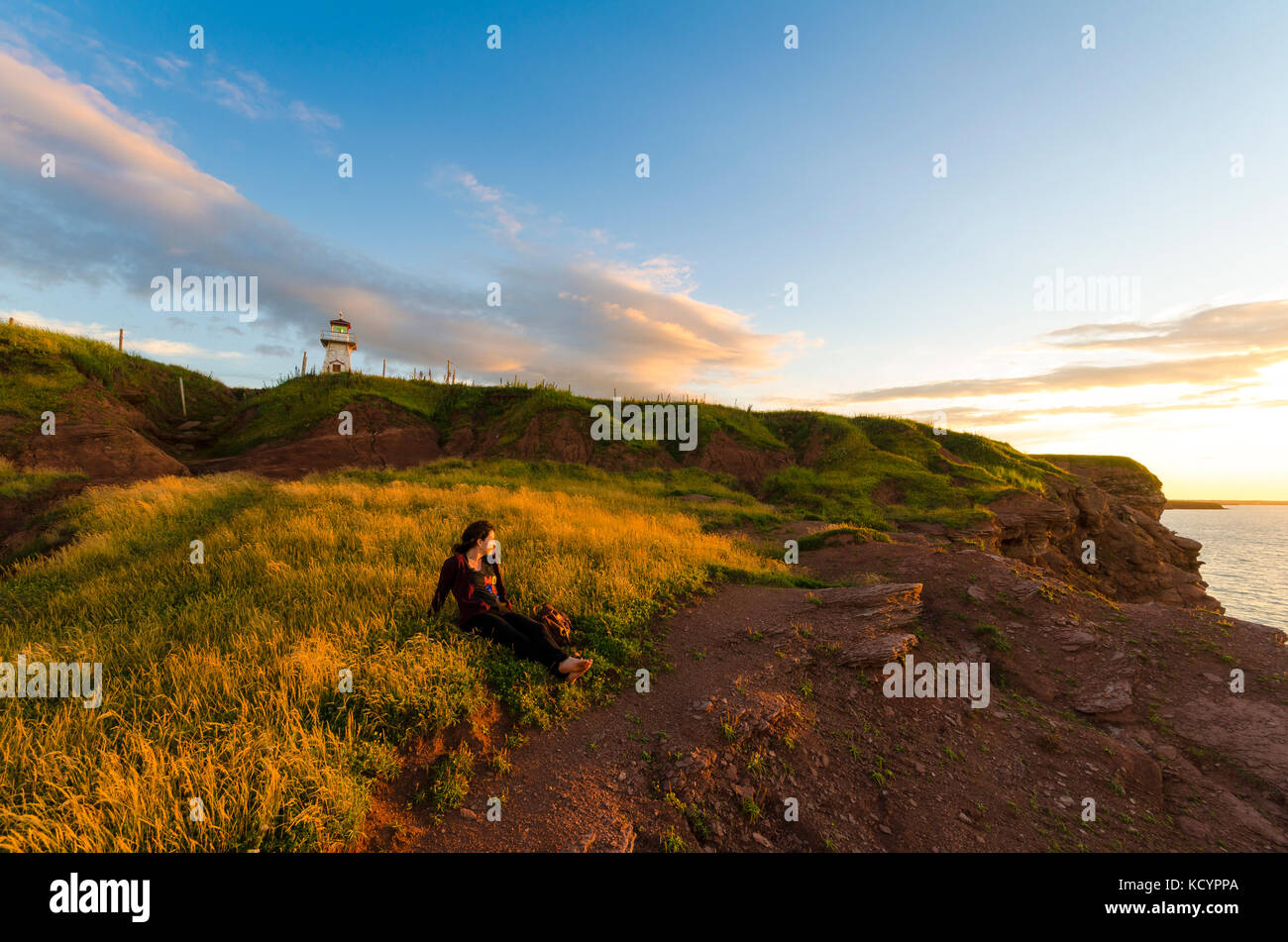 woman, sunset, cell phone, taking picture, Cape Tryon, Prince Edward ...