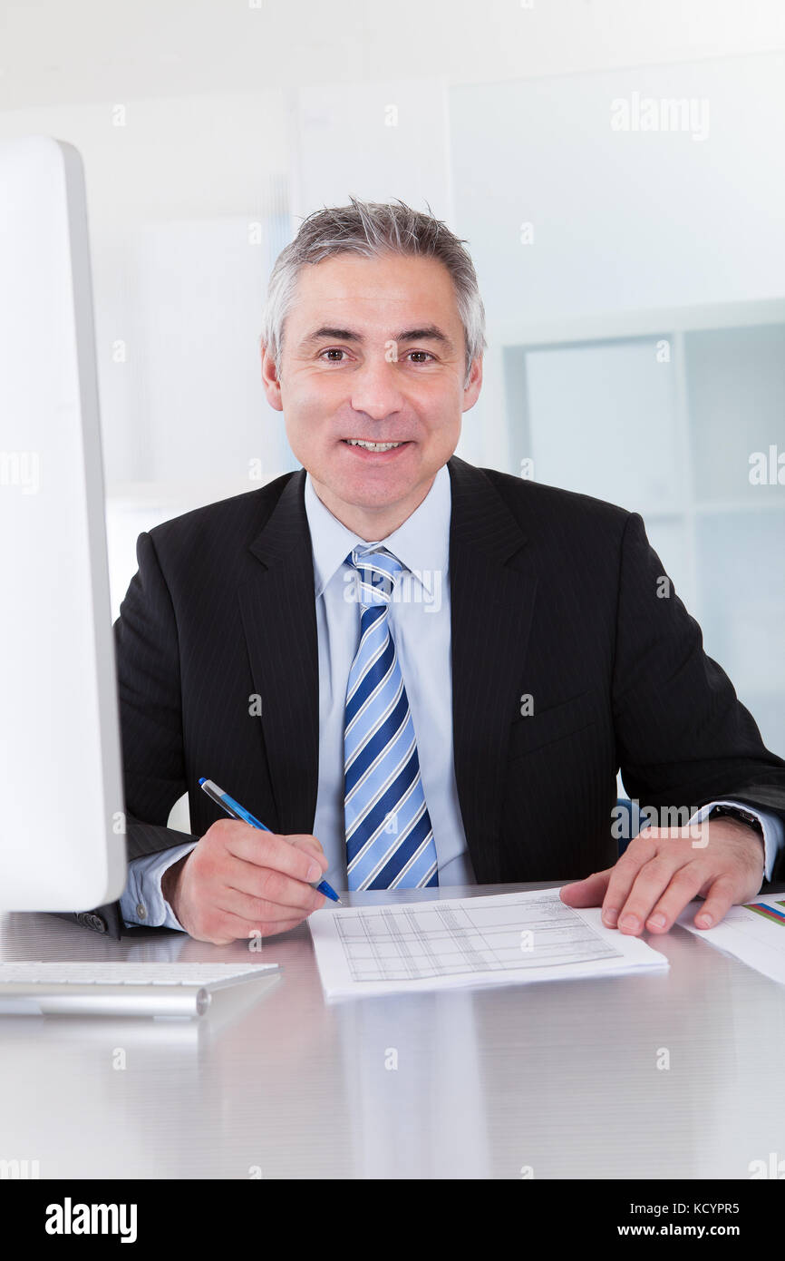 Mature businessman desk office hi-res stock photography and images - Alamy