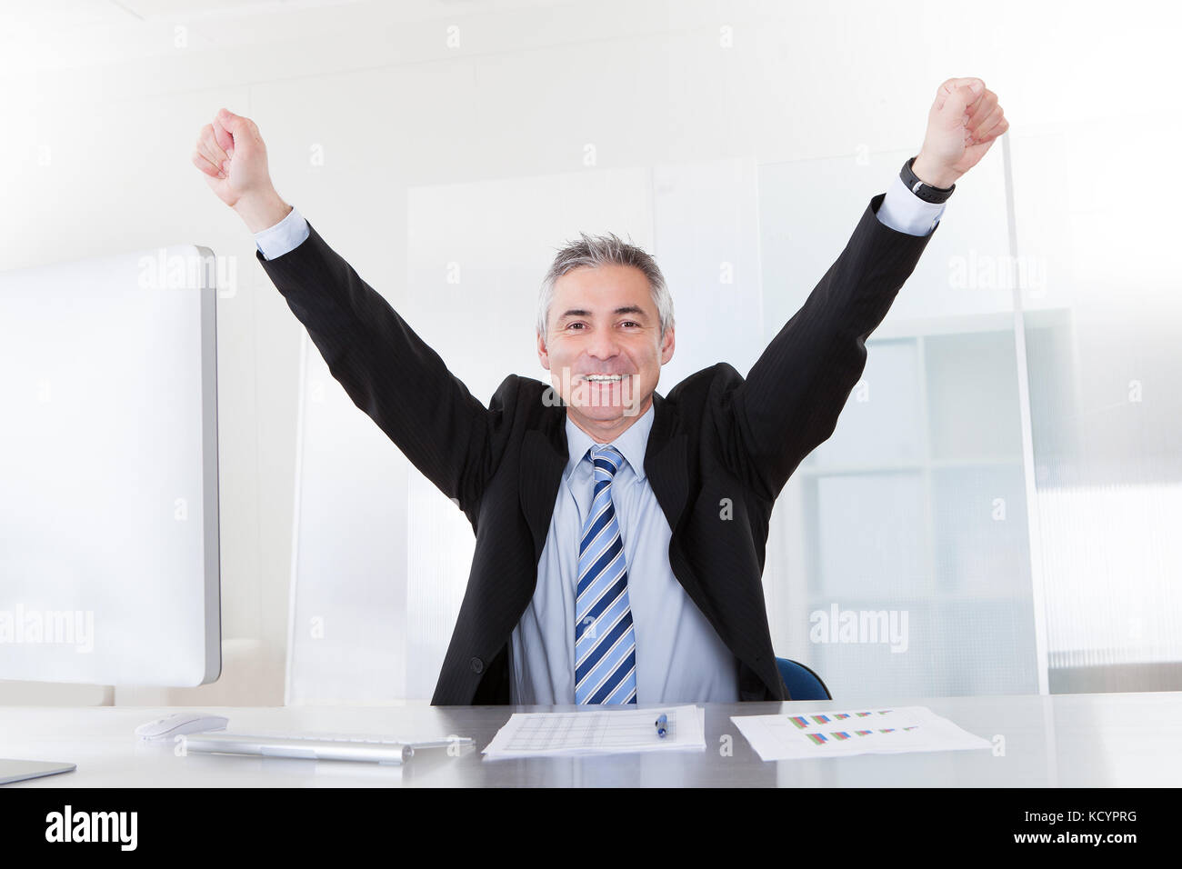 Man in suit raising hands hi-res stock photography and images - Alamy