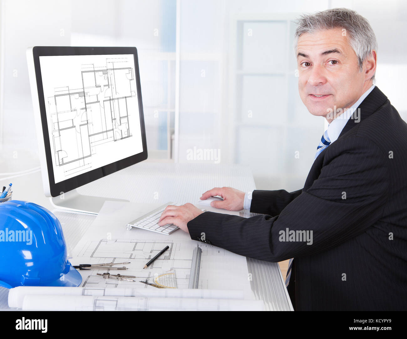 Portrait Of Mature Architect Male With Blueprint In The Office Stock ...