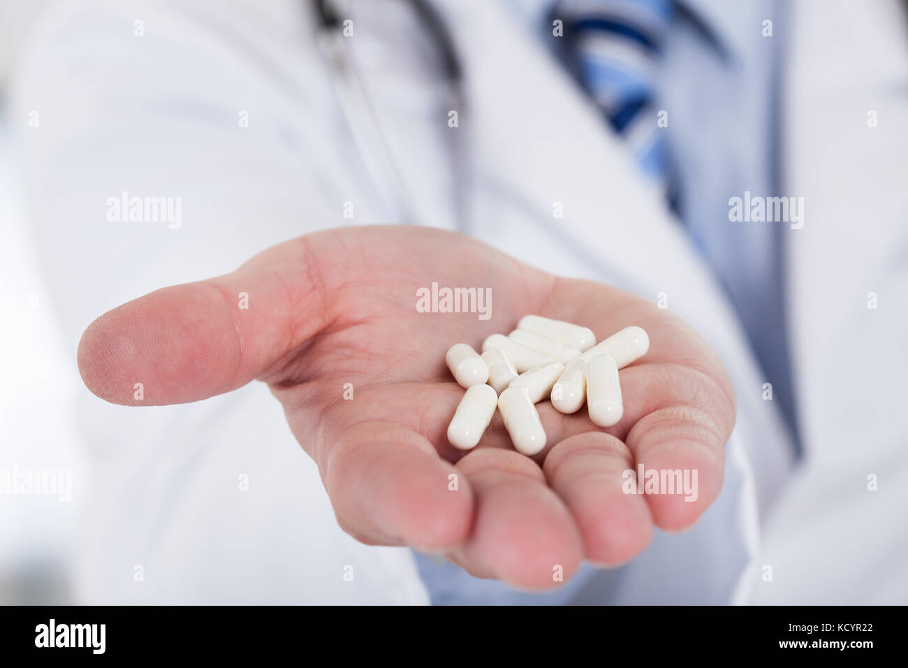 Close-up Of The Male Doctor Offering Pills Stock Photo - Alamy