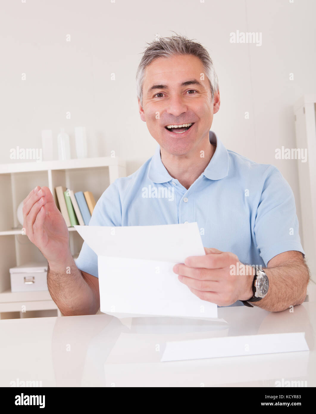 Excited senior man holding hi-res stock photography and images - Alamy