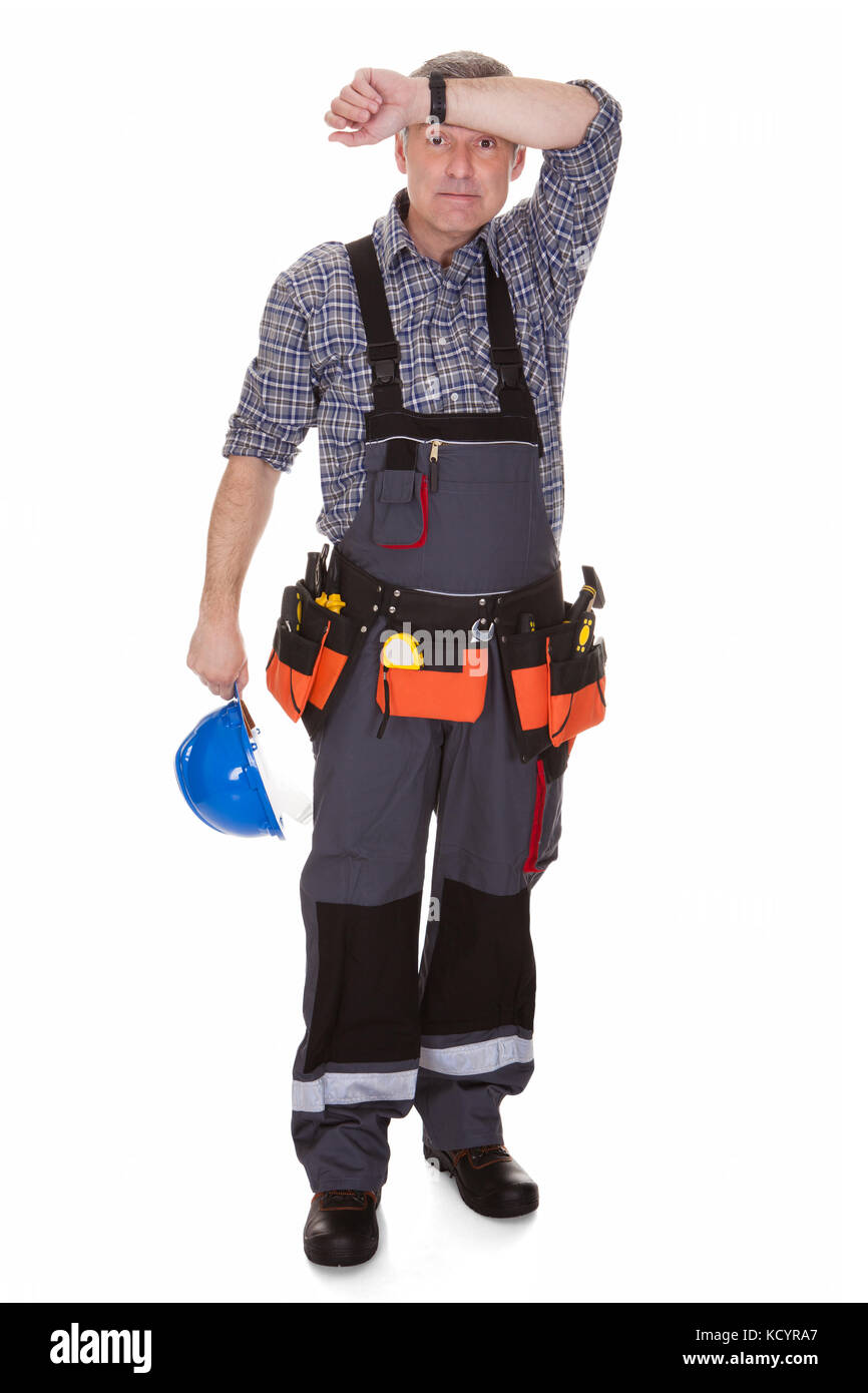 Repairman Holding Hard Hat Over White Background Stock Photo - Alamy