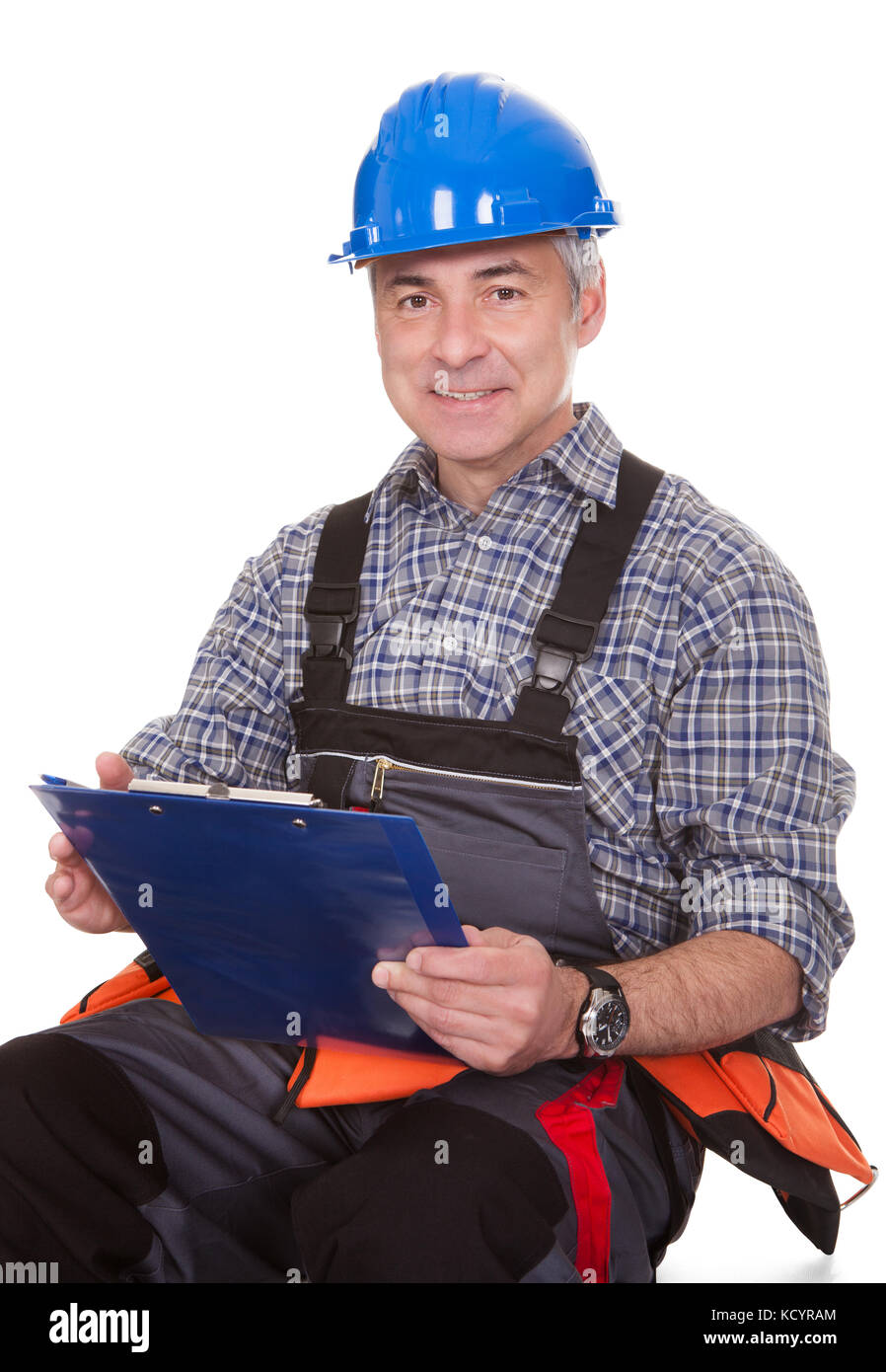 Mature Technician Holding Clipboard Over White Background Stock Photo ...