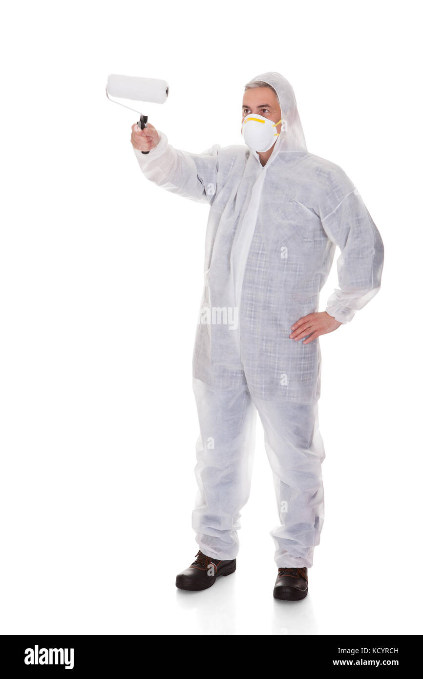 Man Holding Painting Roller Over White Background Stock Photo - Alamy