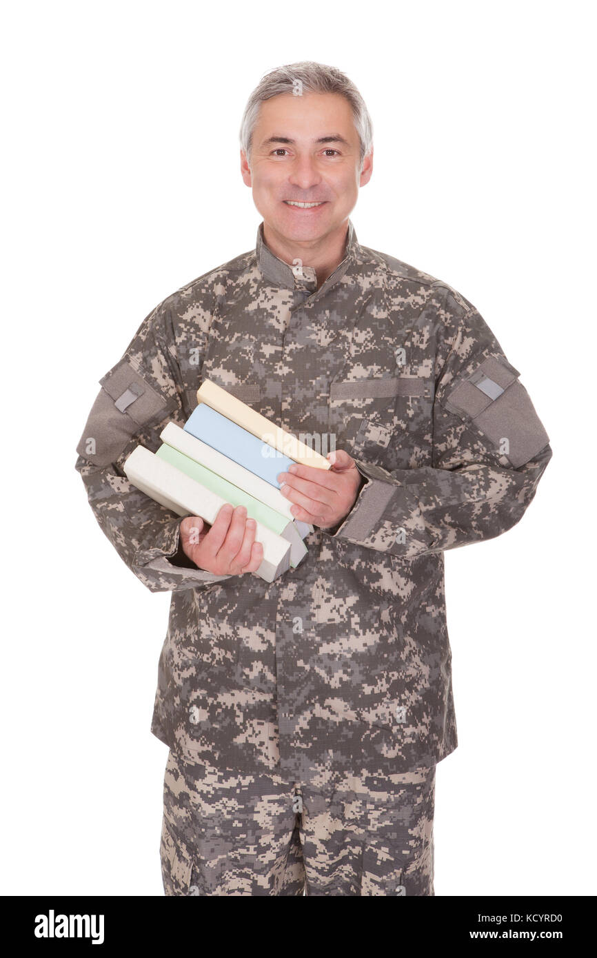 Mature Soldier Holding Stack Of Books Isolated On White Background ...