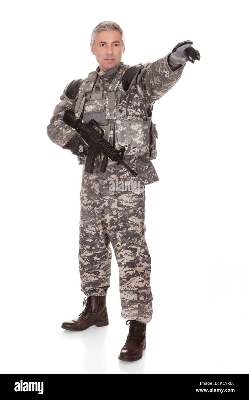 Soldier holding gun rifle hi-res stock photography and images - Alamy