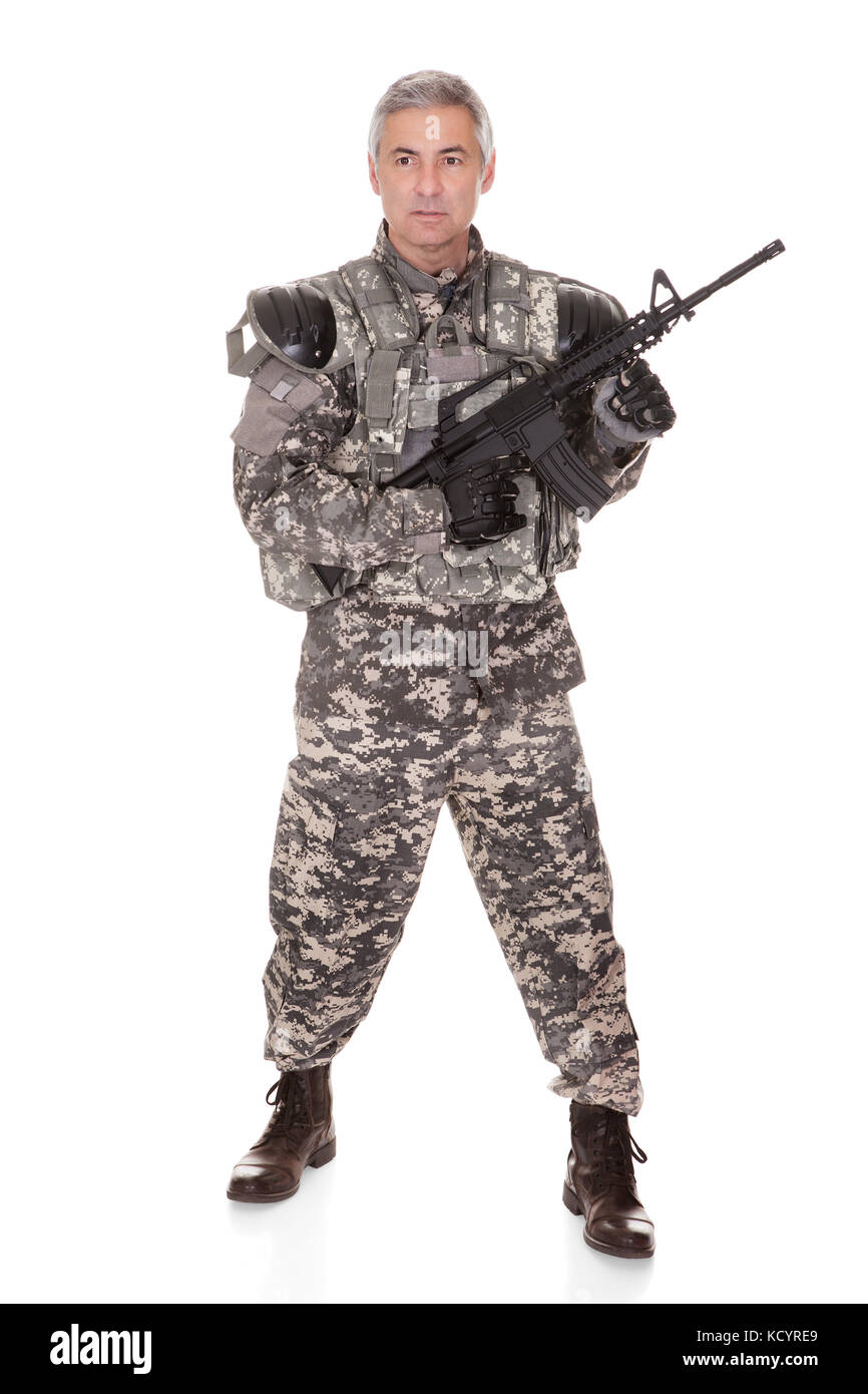 Soldier holding gun rifle hi-res stock photography and images - Alamy