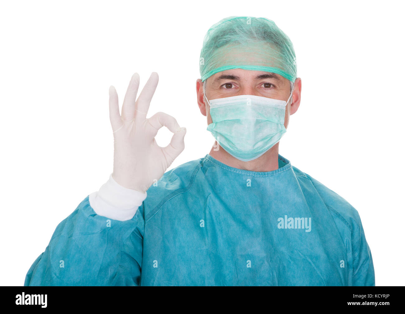 Mature Male Surgeon Gesturing Ok Sign Over White Background Stock Photo ...