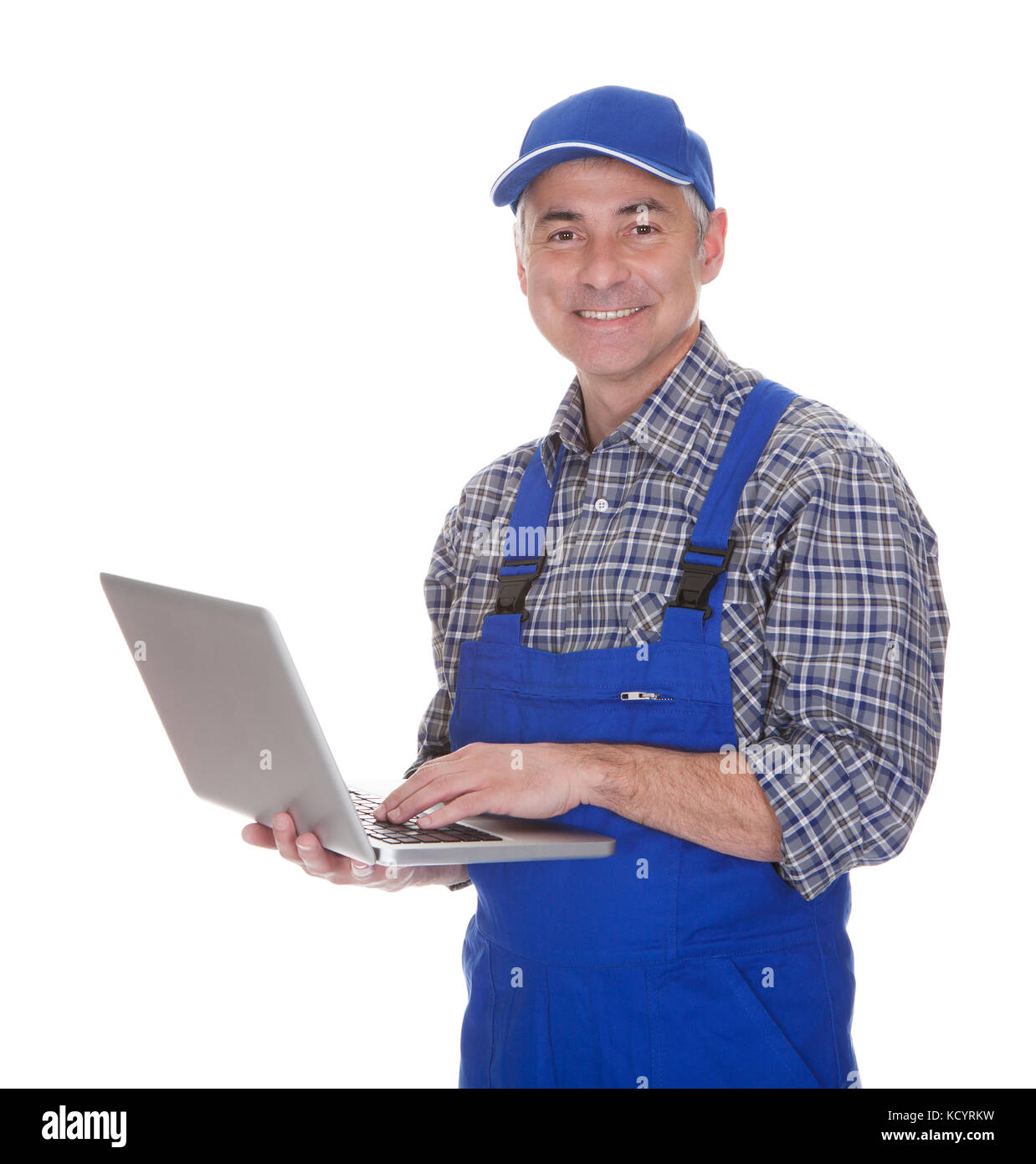Mature Male Technician Using Laptop Over White Background Stock Photo ...