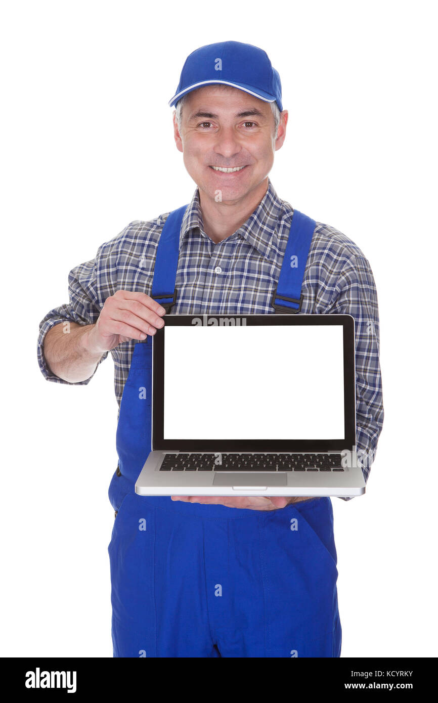 Mature Male Technician Showing Laptop Over White Background Stock Photo ...