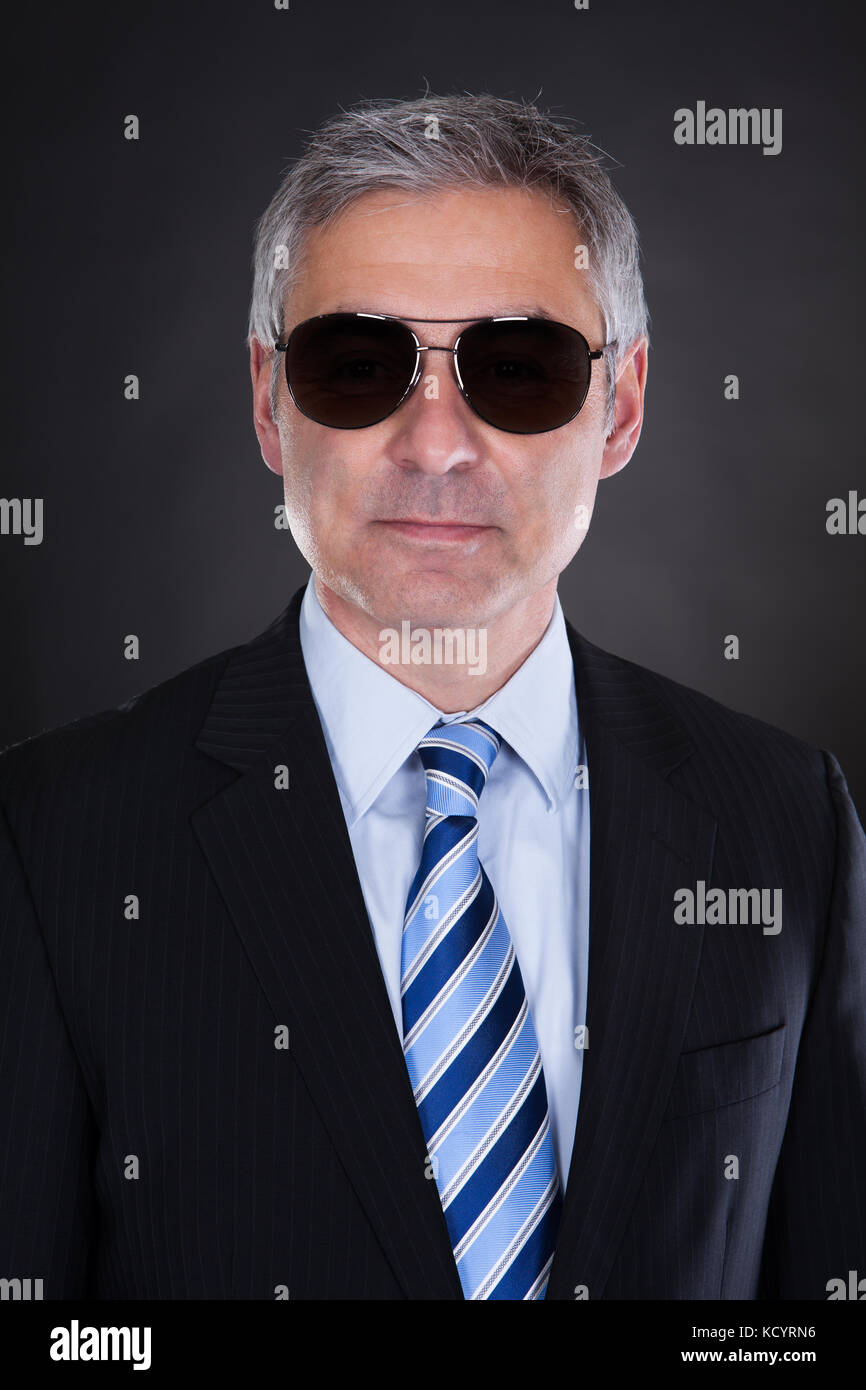 Portrait Of Male Body Guard Over Black Background Stock Photo - Alamy