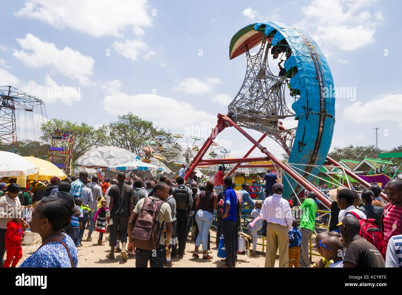 Fairground with rides and people, Nairobi International Trade Fair ...