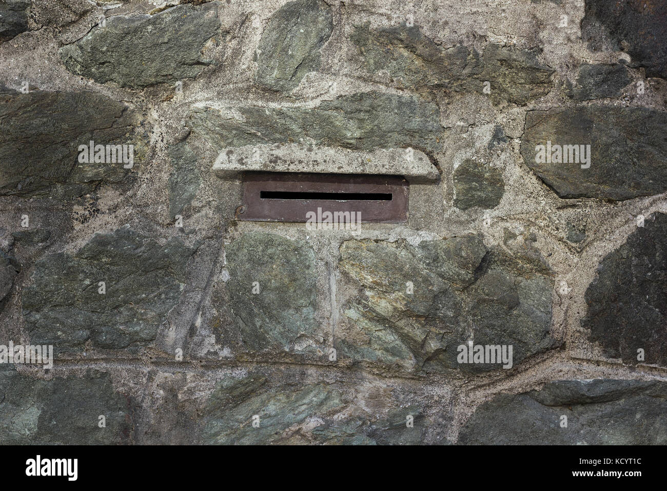 Mailbox opening on a stone wall Stock Photo - Alamy