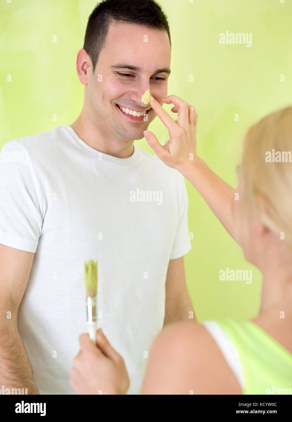 young couple having fun while painting home Stock Photo - Alamy