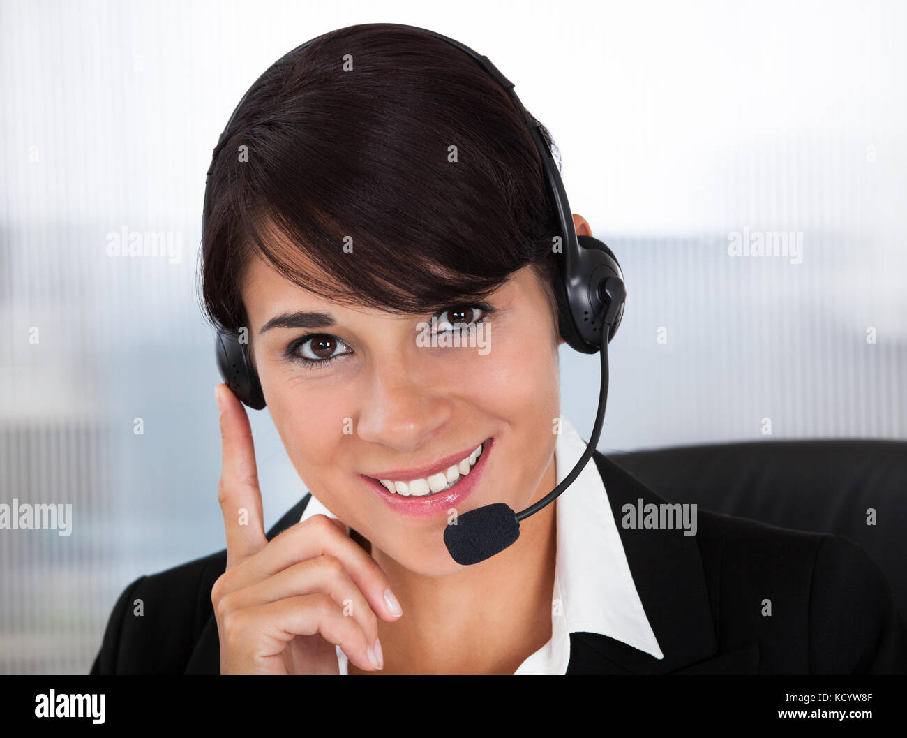 Happy Young Female Callcenter Employee Wearing Headset In Office Stock ...