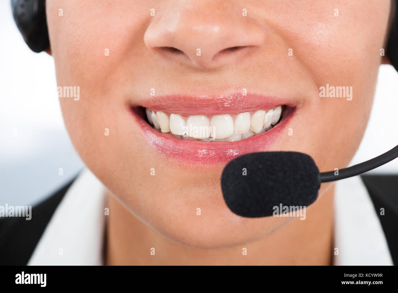 Happy Young Female Callcenter Employee Wearing Headset In Office Stock ...