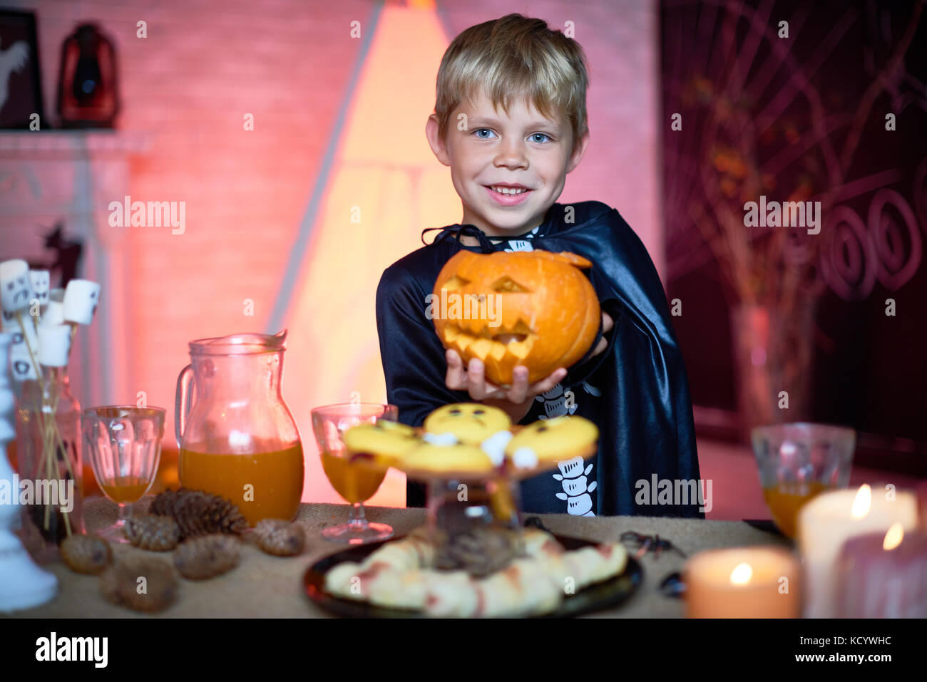 Waist-up portrait of handsome little boy wearing skeleton costume ...