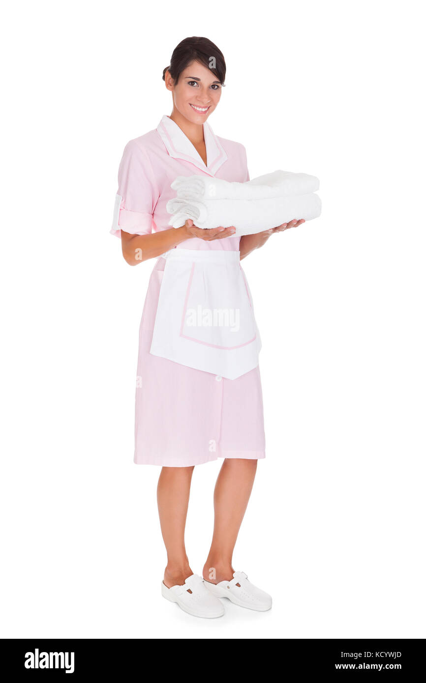 Happy Female Maid Holding Stack Of White Towels Over White Background ...