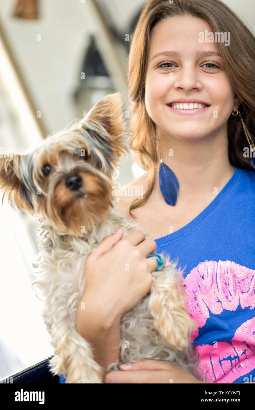 Smiling teen girl with her little dog Stock Photo - Alamy