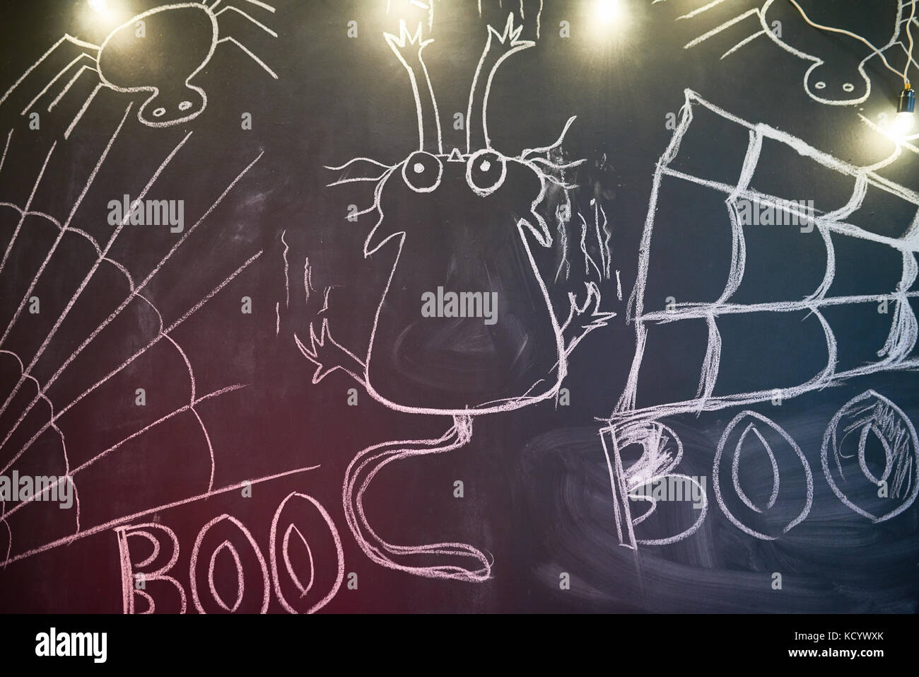 Handmade decoration for Halloween celebration: chalk drawings of cat ...