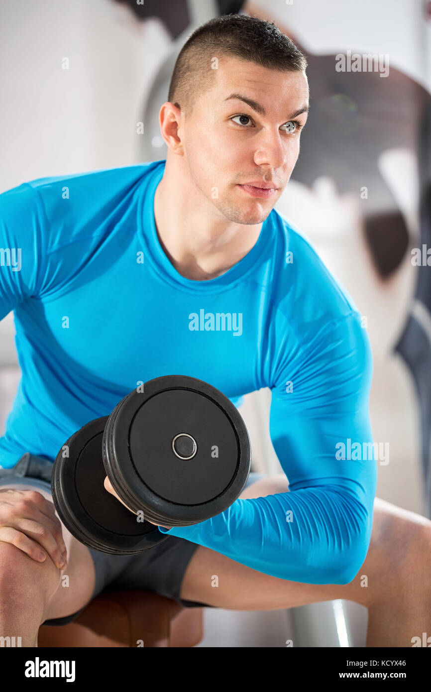 muscle shaped body man with weights Stock Photo - Alamy