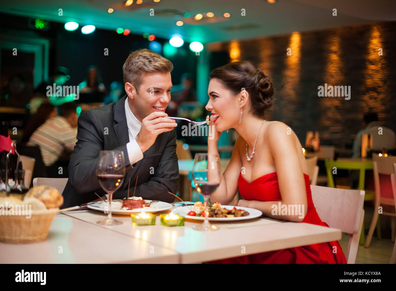 Lovely young couple eating on romantic dinner Stock Photo - Alamy