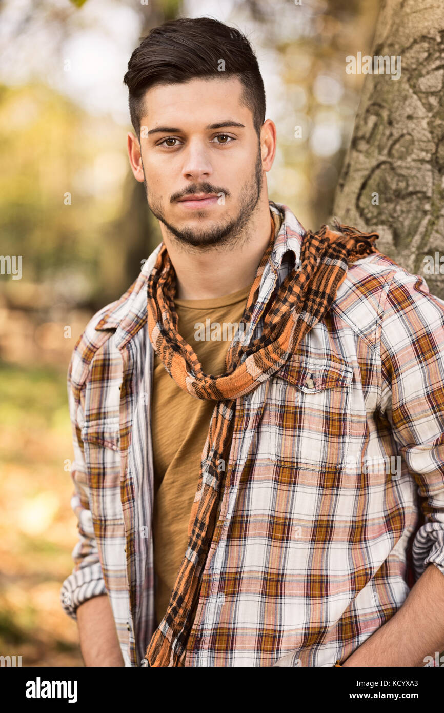 Fashion young man in a checkered shirt Stock Photo - Alamy