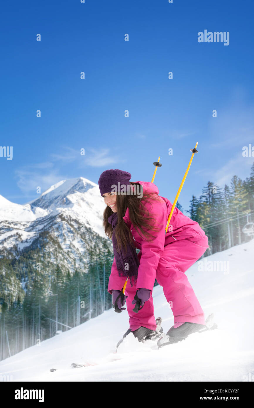 Female skier skiing in powder snow Stock Photo - Alamy