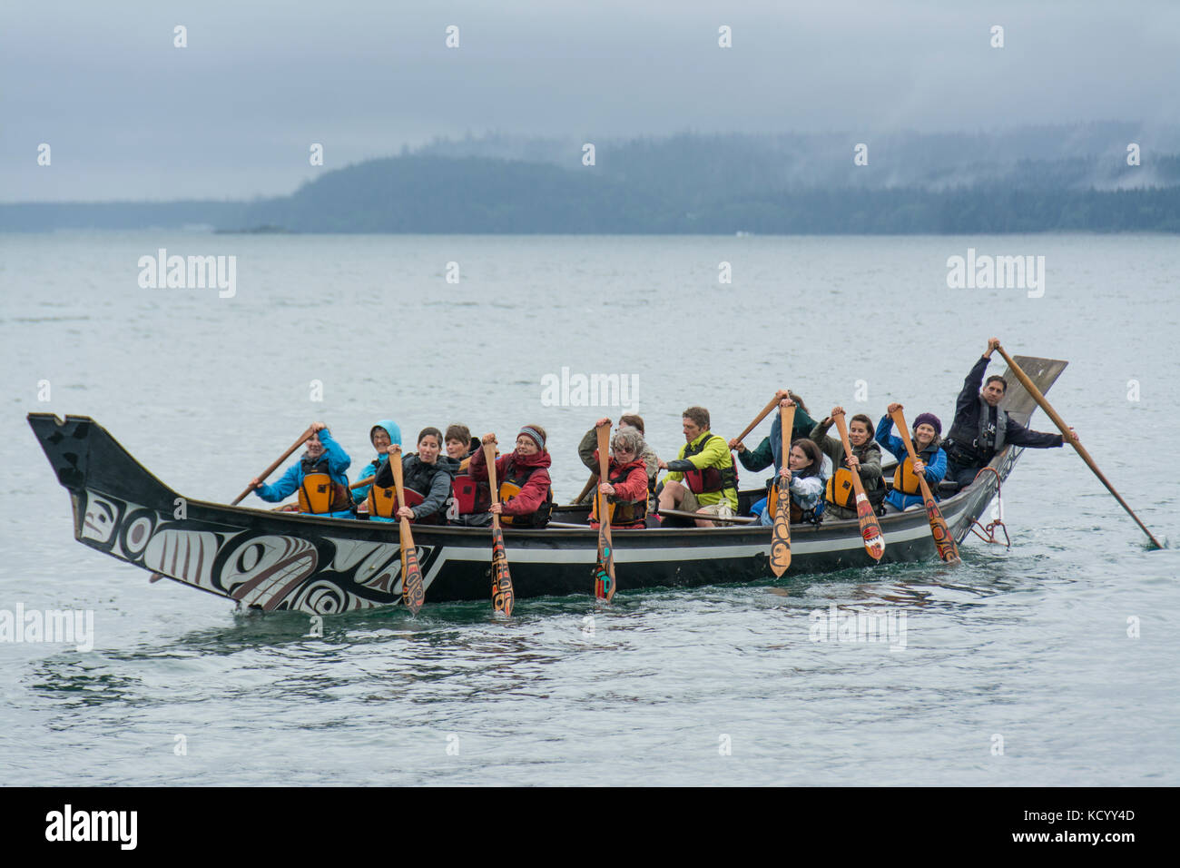 Visitors paddle Loo Plex, replica of the Bill Reid cedar canoe, Lootaas ...