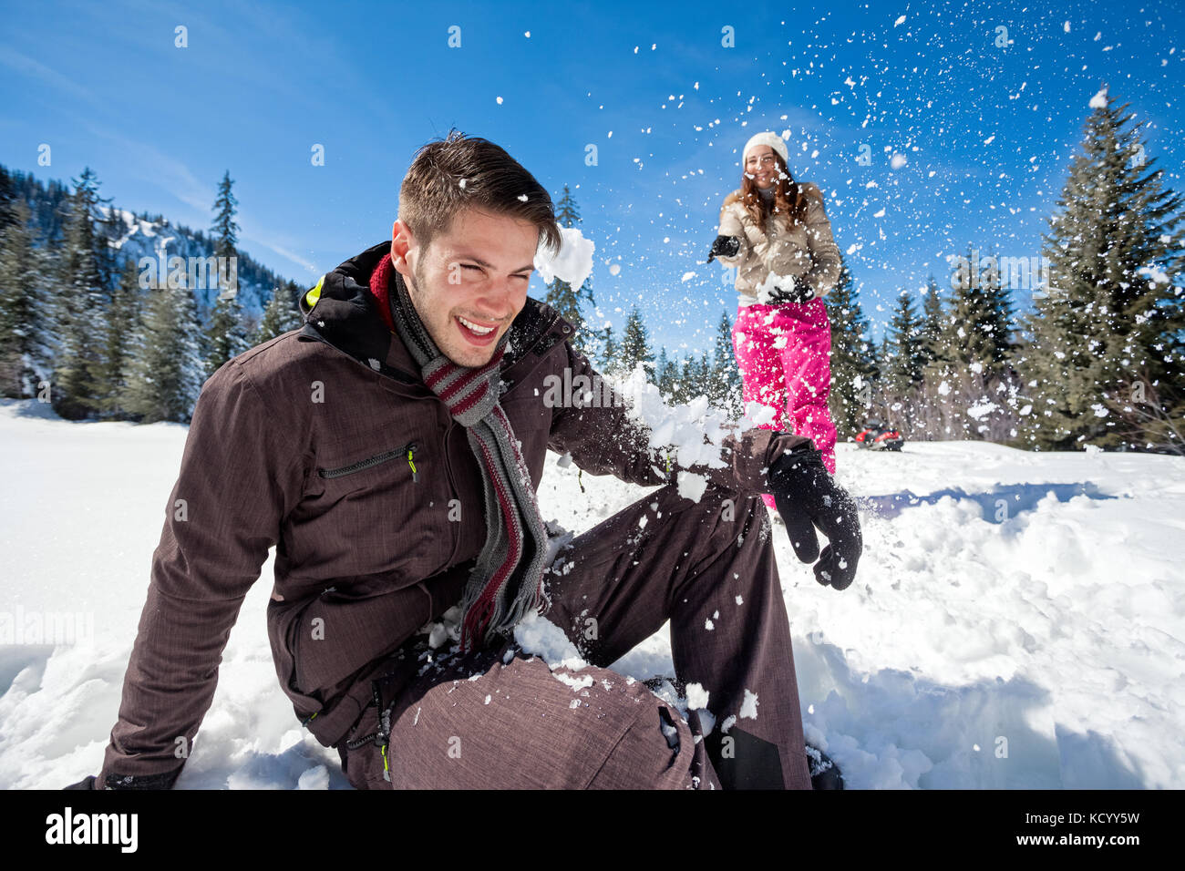 Couple snowball fighting in hi-res stock photography and images - Alamy