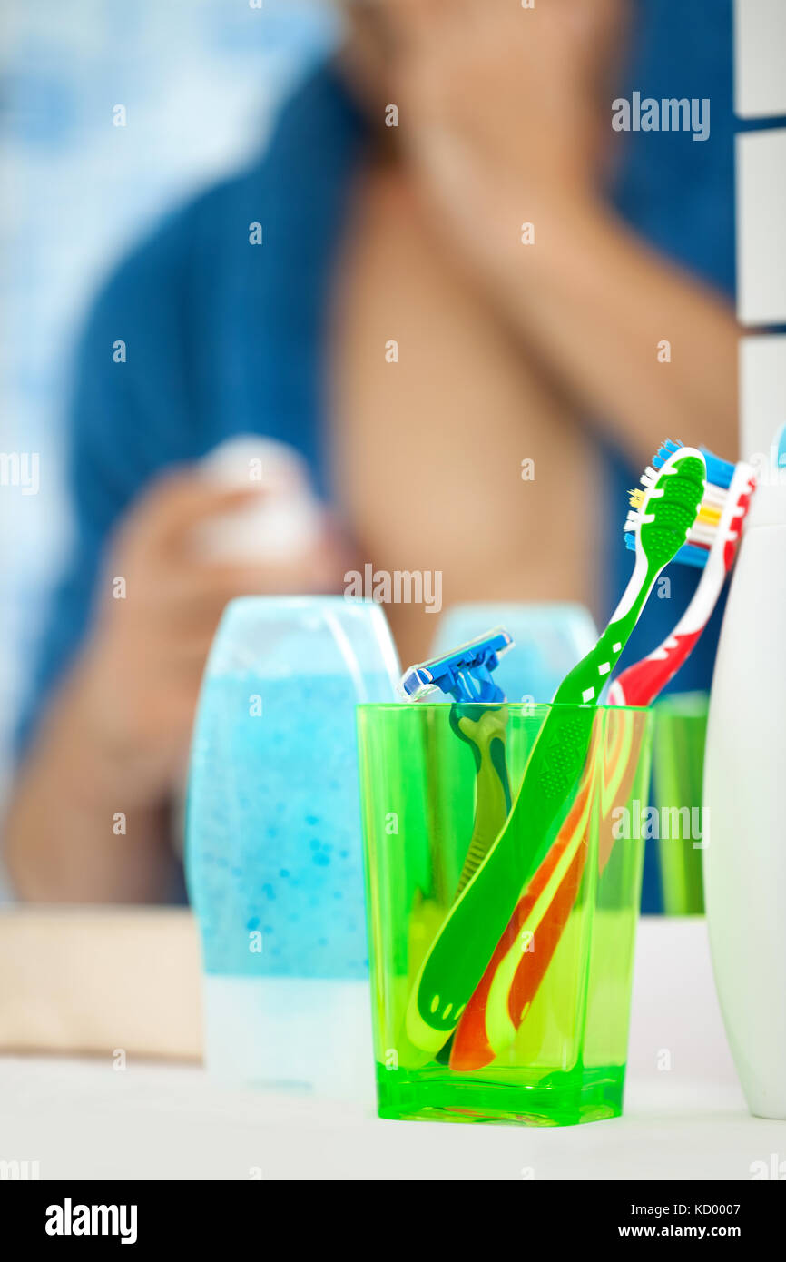 Accessories in bathroom front of mirror: toothbrush, Shower Gel… Stock ...