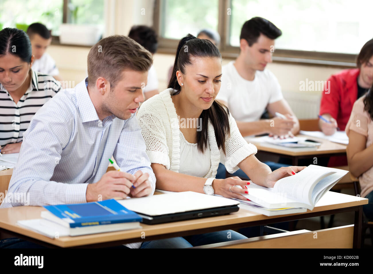 colleagues students studying together in classroom Stock Photo - Alamy
