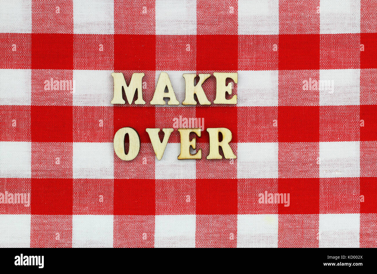 Makeover written with colorful wooden letters on red and white ...