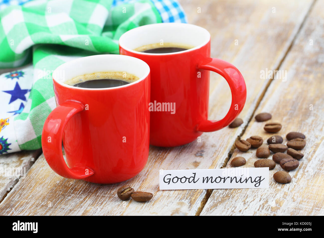 Good morning card with two red mugs of coffee and coffee beans on ...