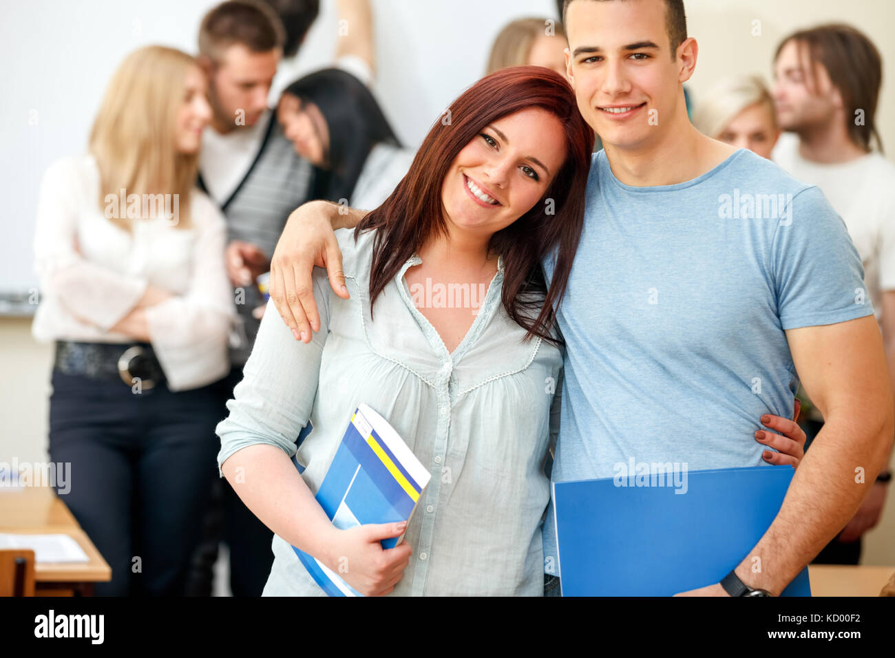 Happy students couple Stock Photo - Alamy
