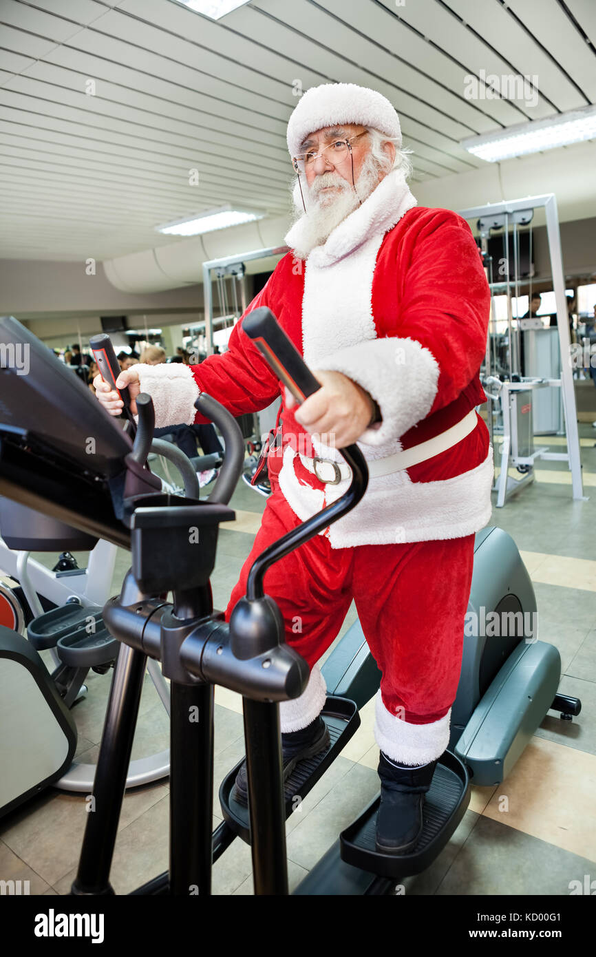 Santa Claus doing exercises before delivering presents Stock Photo - Alamy