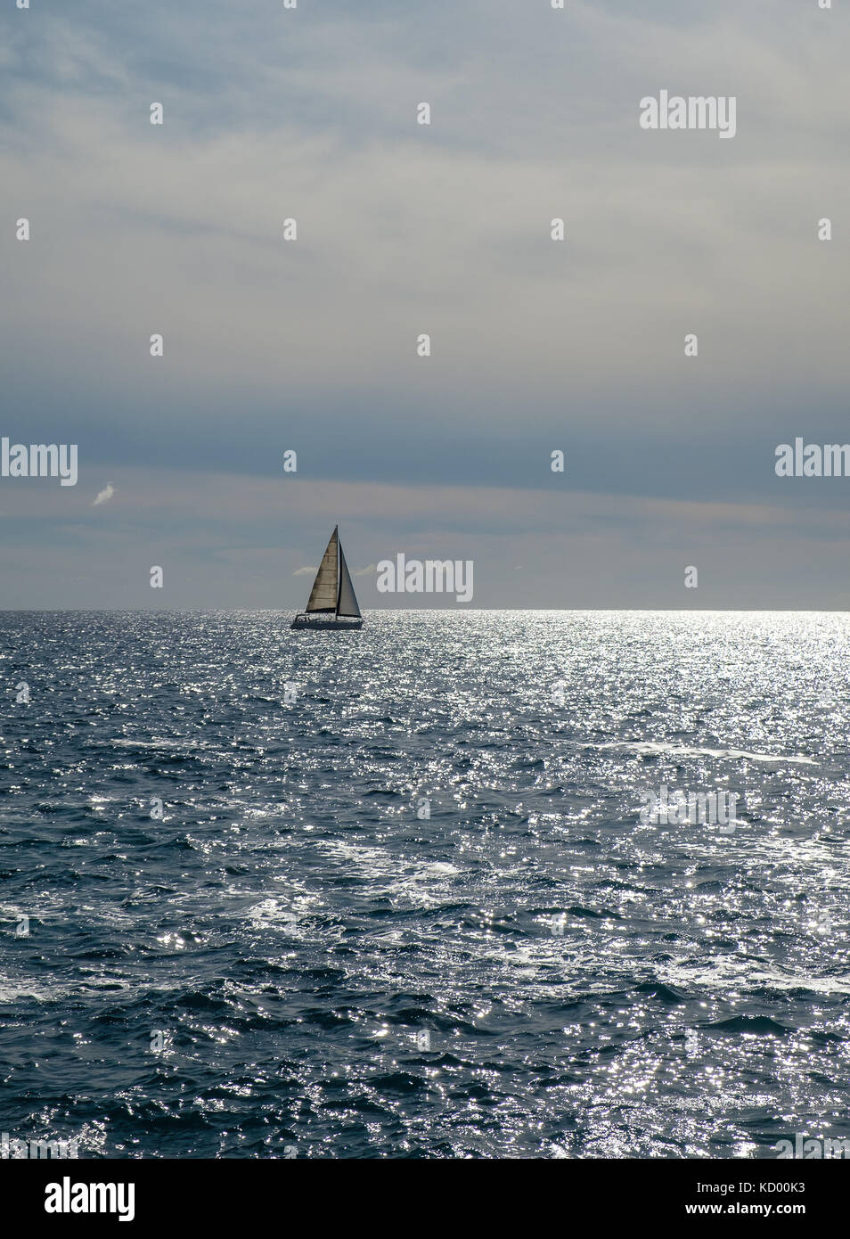 sail boat at horizon line Stock Photo - Alamy