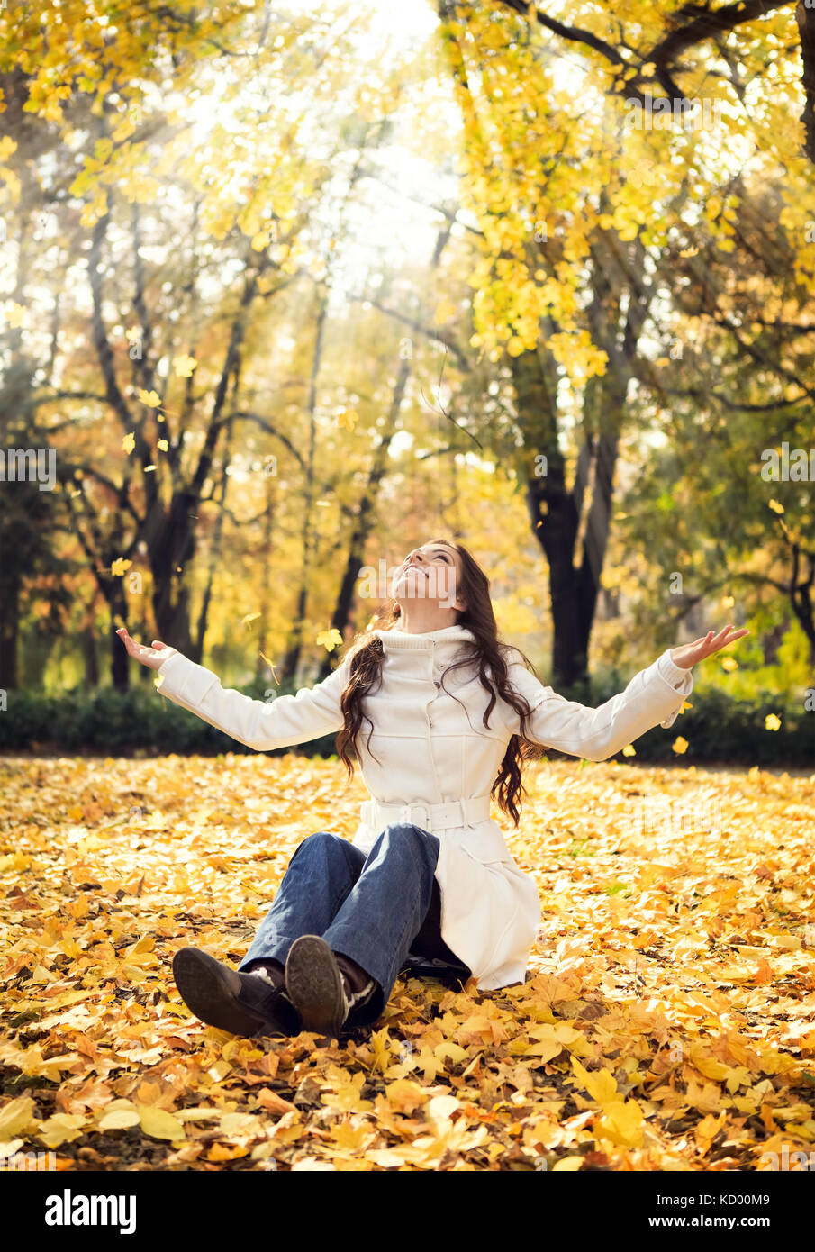 Beautiful young woman in autumn park Stock Photo - Alamy